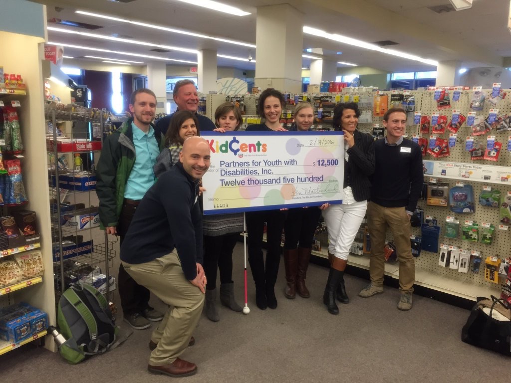 Rite Aid KidCents photo with check – Partners for Youth with Disabilities